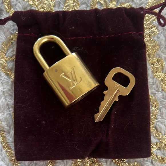 Louis Vuitton | Accessories | Lv Lock Key 3 Gold | Poshmark